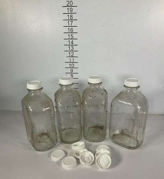 Set of Four Clear Glass Bottles with Screw-Top Plastic Caps - Hash Auctions