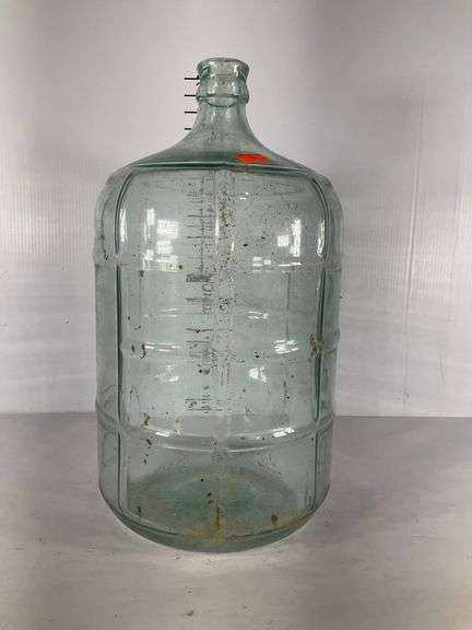 Clear Glass Bottle With Embossed Markings - Hash Auctions
