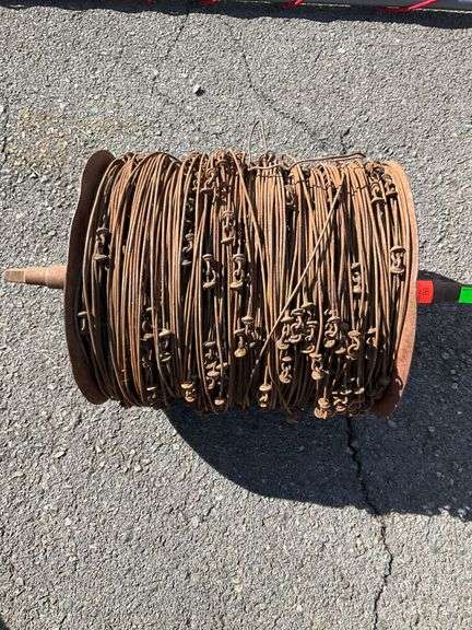 Large Roll of Vintage Rusted Barbed Wire on Metal Spool - Hash Auctions