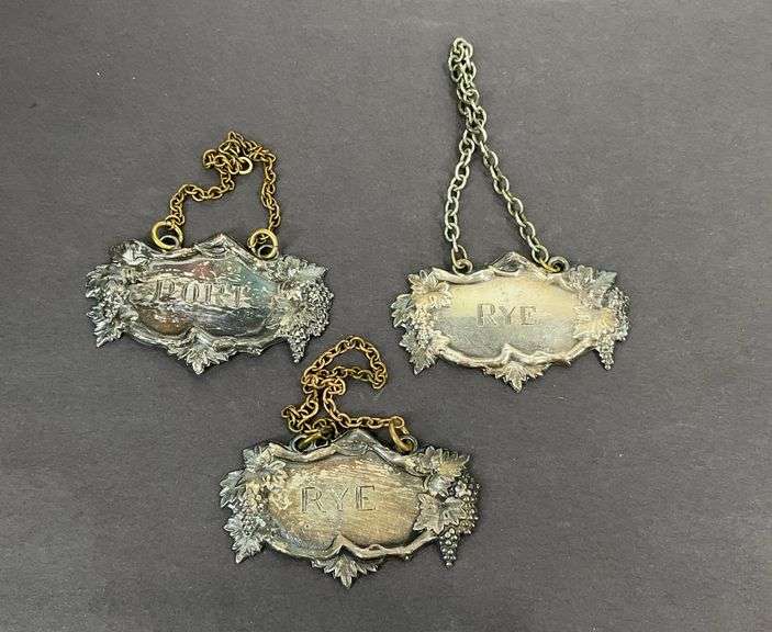 Three silver plate decanter labels made in England - Hash Auctions