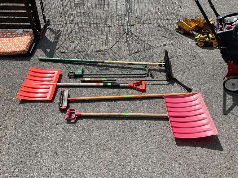 Collection of Outdoor Tools Including Snow Shovels, Rakes, and Garden ...