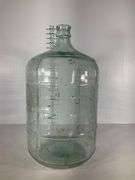 Clear Glass Bottle With Embossed Markings - Hash Auctions