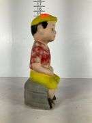 Painted Figurine of a Boy Seated on a Rock - Hash Auctions