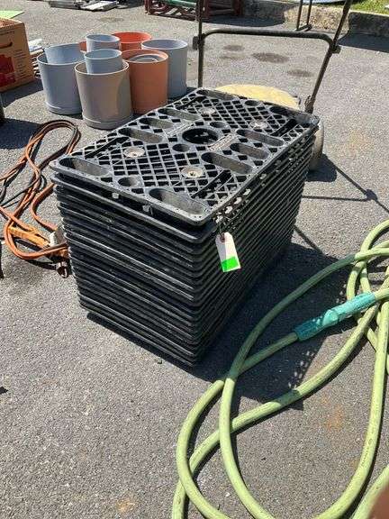 Stack of 20 Black Plastic Feed Bag Pallets - Hash Auctions