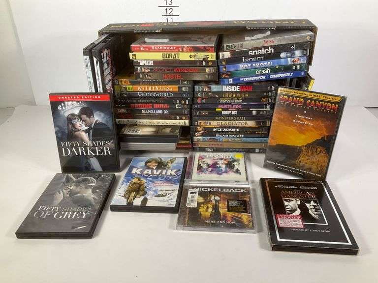 Assorted Collection of DVDs and CDs Featuring Movies and Music Albums ...