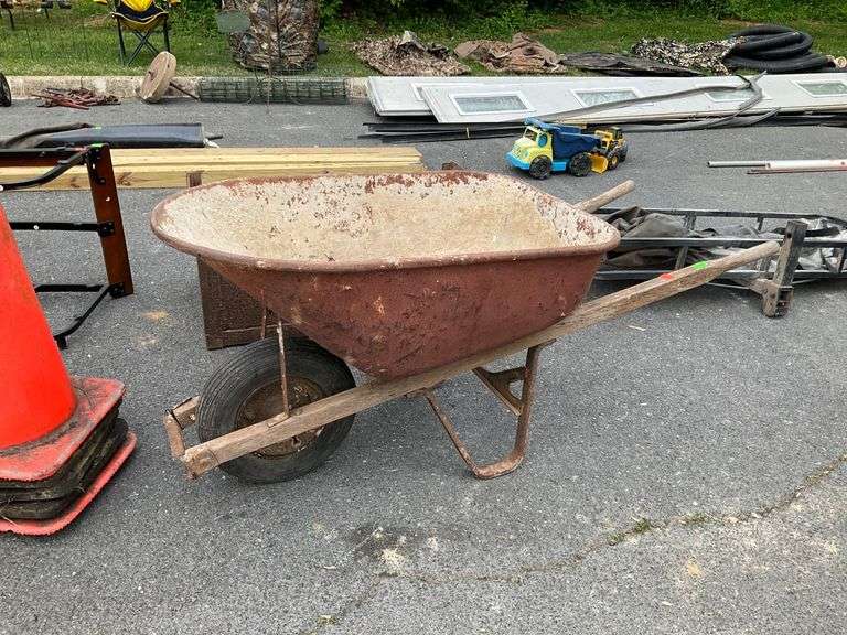 Wheelbarrow With Metal Hopper and Wooden Handles - Hash Auctions