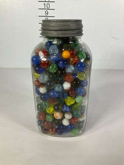 Canadian Mason Jar Filled with Assorted Marbles - Hash Auctions