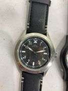 Four wrist watches and a pocket watch, Timex and omega are running, the ...