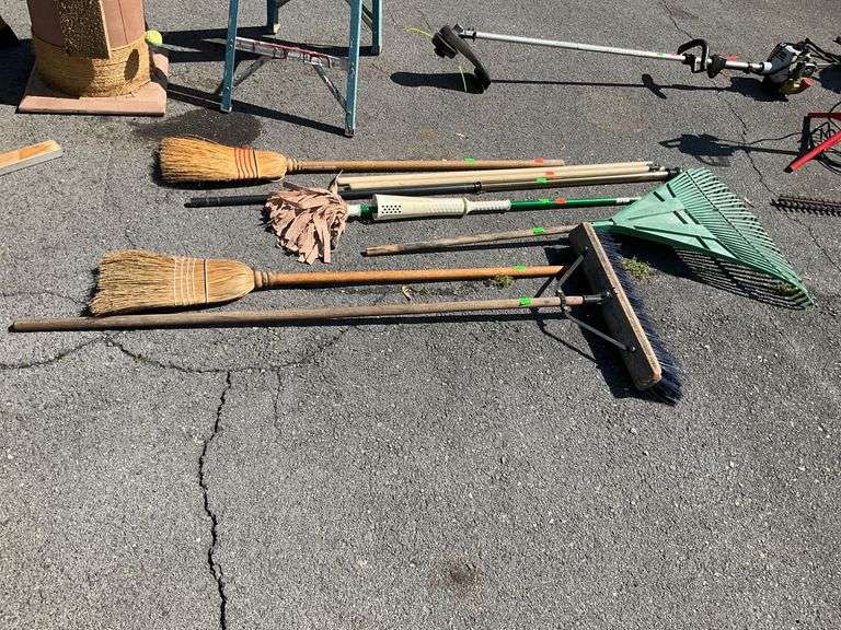Assorted Yard Tools Including Push Broom, Leaf Rake, and Brooms with ...