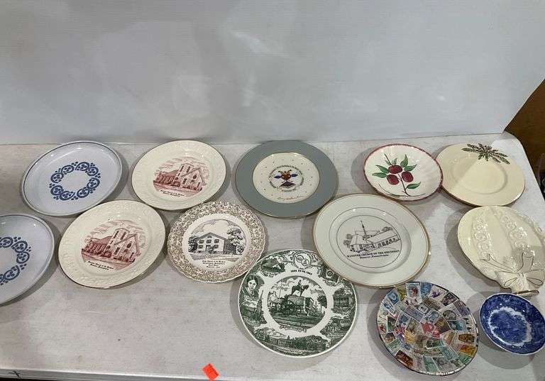 Collection of Assorted Decorative Plates Featuring Various Designs and ...