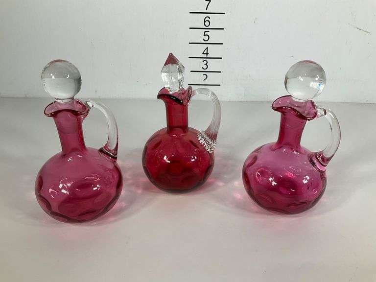Three Cranberry Thumbprint Glass Cruets with Clear Stoppers - Hash Auctions