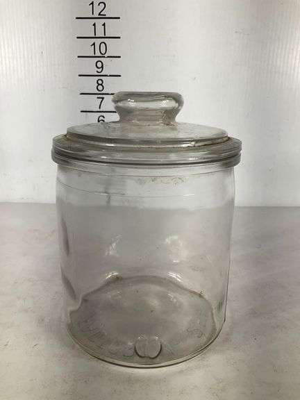 Clear Glass Jar with Embossed Markings and Lid - Hash Auctions