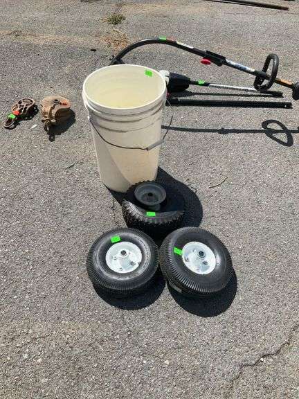 Bucket with three cart type wheels and tires. - Hash Auctions