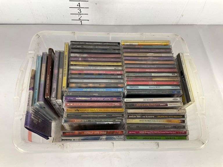 Music CDs in Plastic Storage Container - Hash Auctions