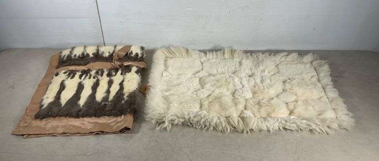 Two Animal Fur Textiles, Including a White Patchwork Mat and a Brown ...