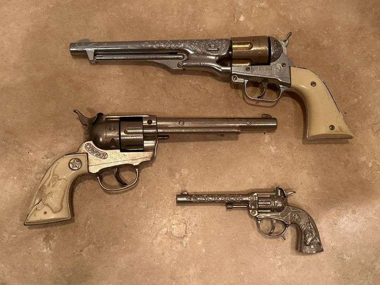 Hubley Model Colt 45 Cap Gun, Hubley Cowboy Revolver Cap Gun, and ...