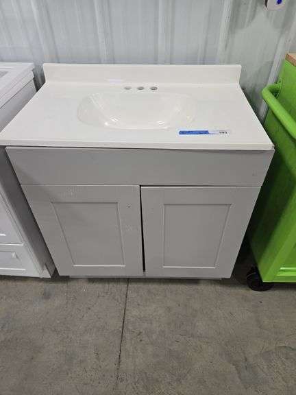 Vanity with sink, no faucet. Backboards are broke. Approx 30"w. 19"d. 33"t - Hoge Auctioneering LLC