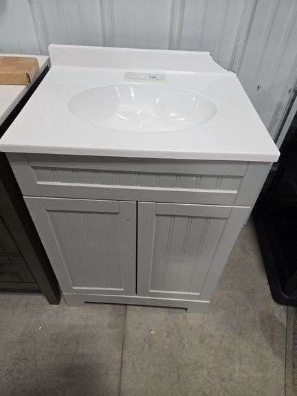 Vanity and sink. No faucet. Back splash on the sink is broke. Approx 24"w. 19"d. 35"t - Hoge ...