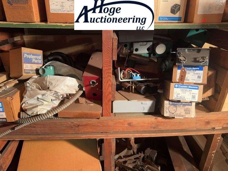 Contents of middle shelf. Several control boxes, several gas valve ...