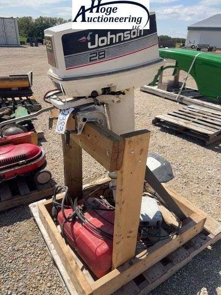Johnson 28 outboard motor with gas tank and stand. Motor runs but needs ...