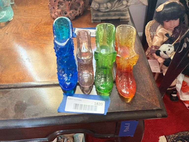 Four glass shoes in various colors: blue, purple, green, amberina ...