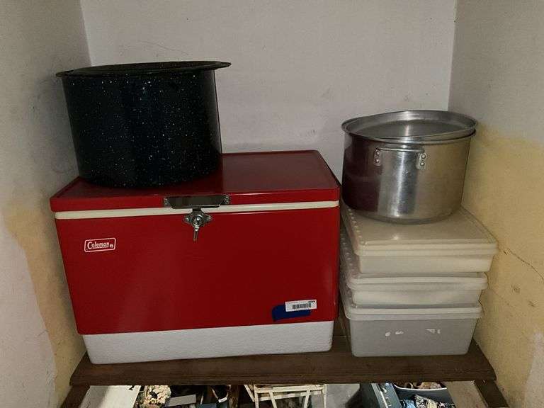 Contents of shelf: Coleman cooler, graniteware canner, stockpot ...