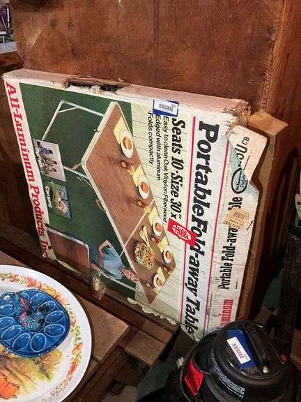Folding table in box - Hurley Real Estate & Auctions