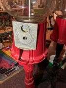 Red gumball machine on floor stand - Hurley Real Estate & Auctions