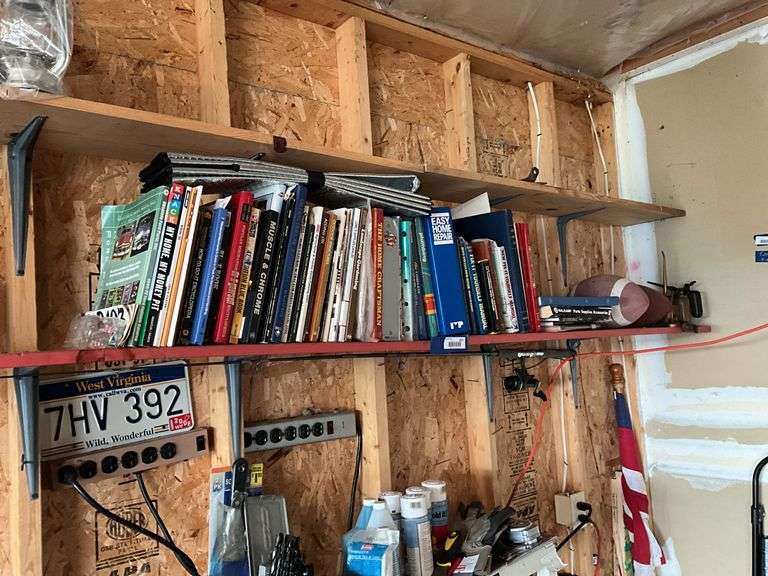 Contents of shelf: automotive manuals, footballs, oil cans - Hurley ...