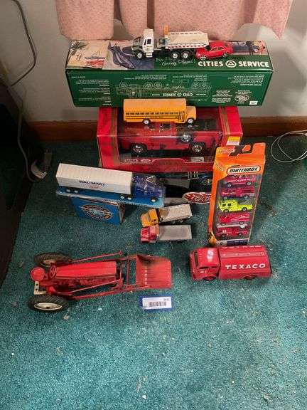 Farm toy tractor, Matchbox cars in box, misc toy cars and trucks ...