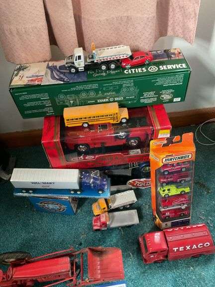 Farm toy tractor, Matchbox cars in box, misc toy cars and trucks ...