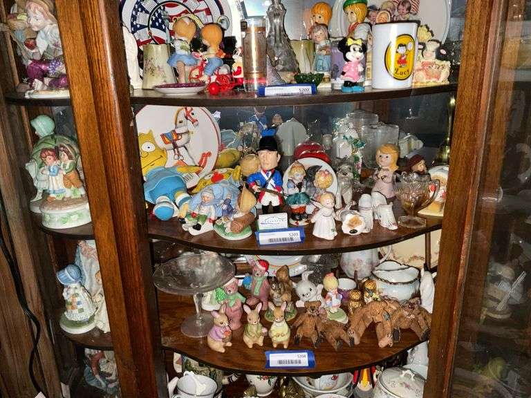 Contents of shelf: figurines, Bart Simpson doll, glassware - Hurley ...