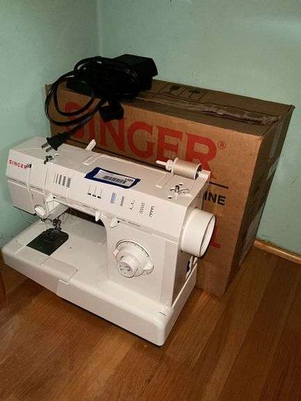 Singer portable sewing machine - Hurley Real Estate & Auctions