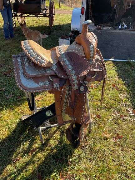 Fancy saddle with lots of tooled silver - Hurley Real Estate & Auctions