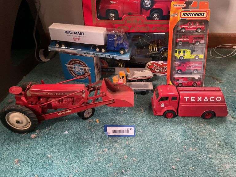 Farm toy tractor, Matchbox cars in box, misc toy cars and trucks ...