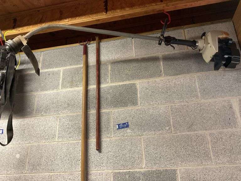 Craftsman leaf blower and attachment, string trimmer, tools hanging on ...