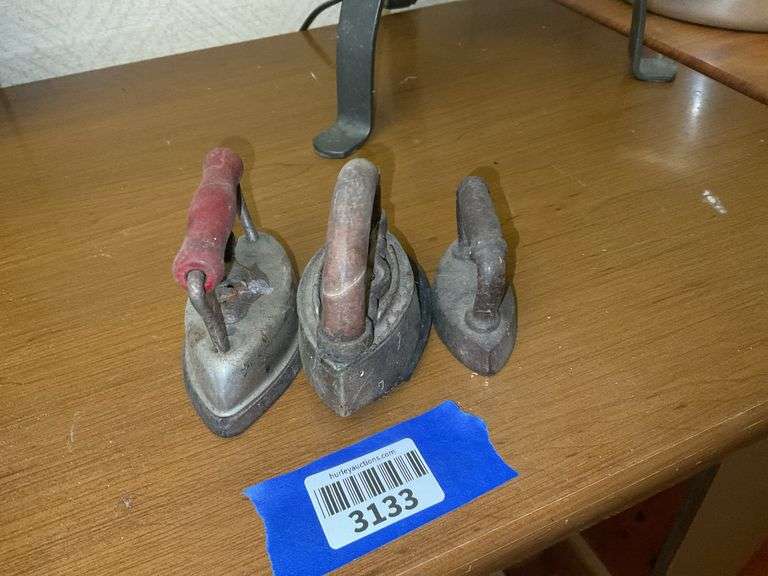 Three small sad irons and one trivet - Hurley Real Estate & Auctions