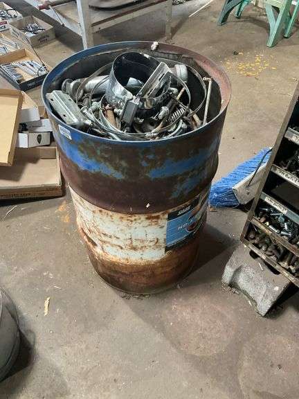 Barrel, full of miscellaneous hardware, scrap metal, parts and pieces ...