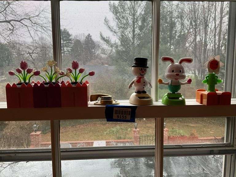 Solar dancers at window - Hurley Real Estate & Auctions