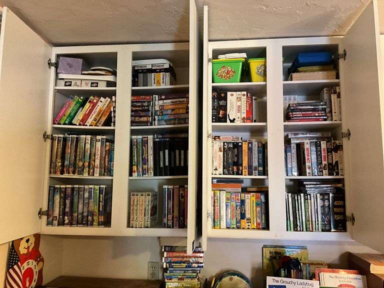 Contents of two toy room cupboards - VHS tapes, DVDs, including Star ...