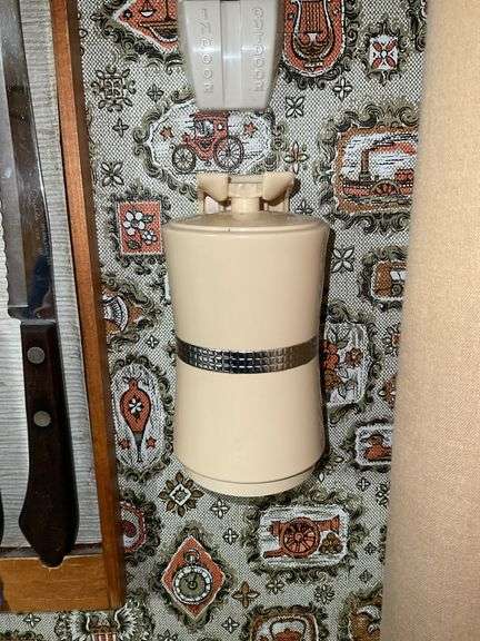 Wall hangings: Oneida knife set in rack, tiles, paper towel holder ...