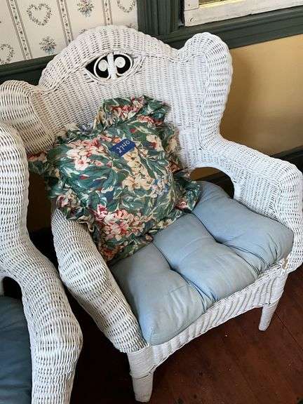 White wicker occasional arm chairs w/ cushions & throw pillows by the ...
