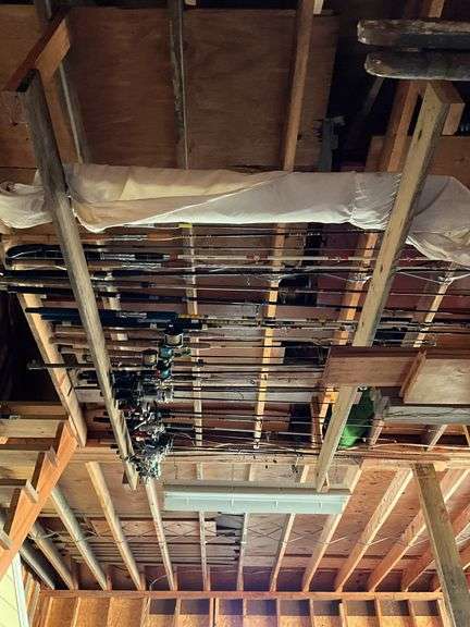 Fishing rods/reels lot hanging from rafters - Hurley Real Estate & Auctions