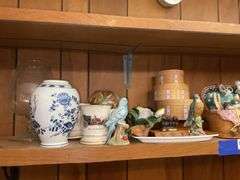 Contents of shelf: Jim Shore sewing box music box, bird figurines ...