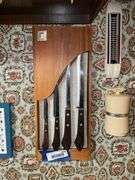Wall hangings: Oneida knife set in rack, tiles, paper towel holder ...