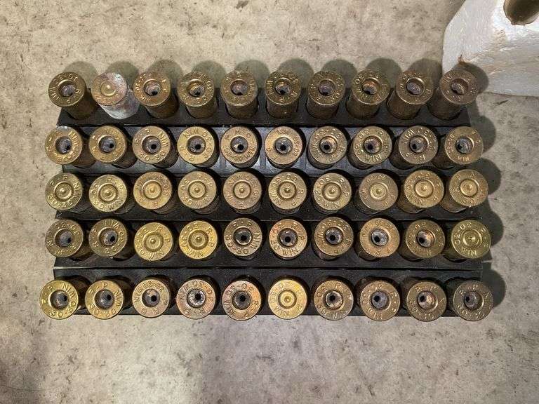 Lot of mixed empty rifle caliber cartridge casings in boxes, shell ...