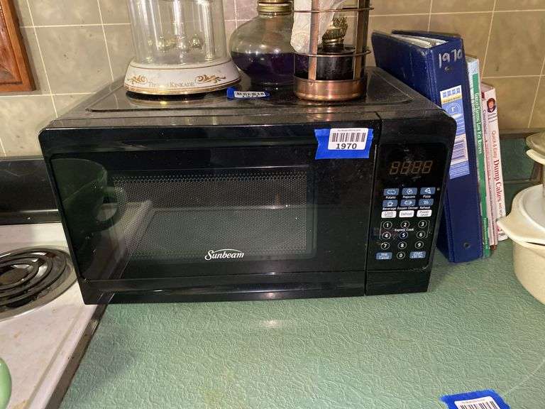 Sunbeam microwave oven and cookbooks - Hurley Real Estate & Auctions