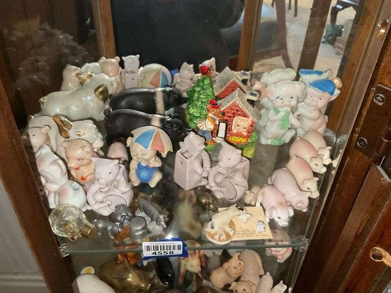 Contents of shelf: pig figurines and collectibles - Hurley Real Estate ...