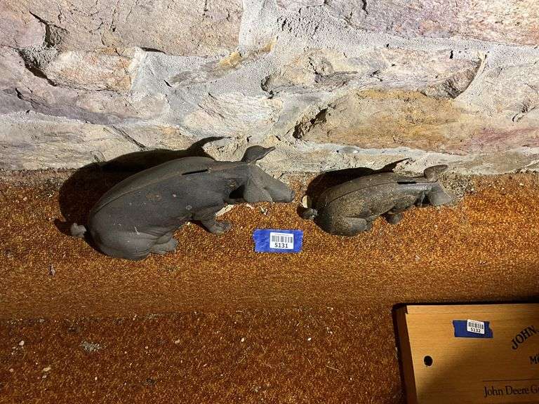 Two cast iron seated pig banks - Hurley Real Estate & Auctions