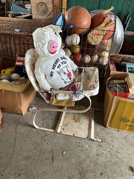 Inflatable pig in vintage baby chair - Hurley Real Estate & Auctions